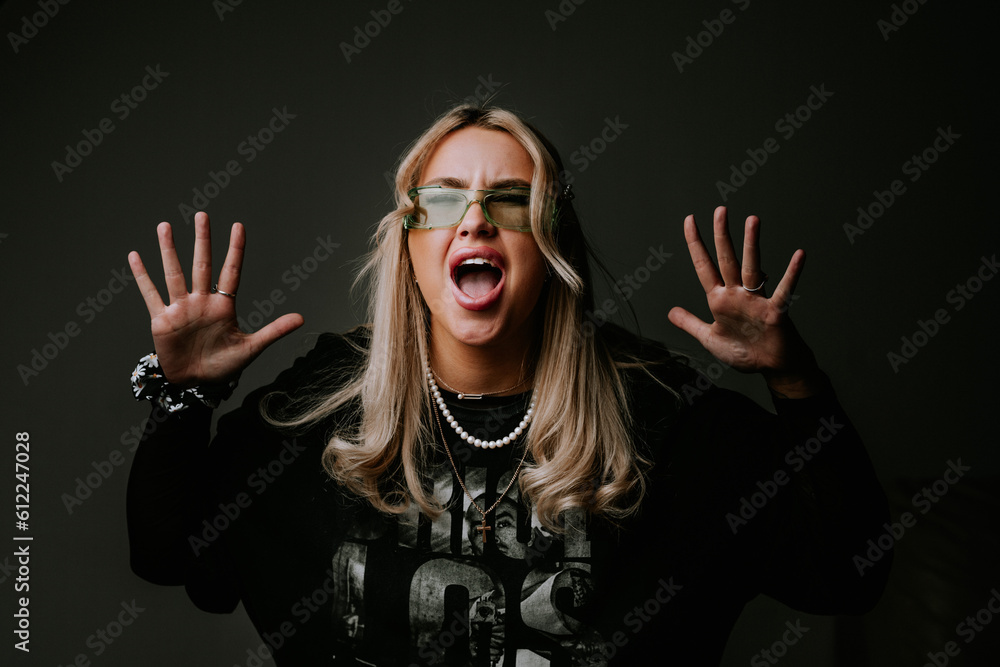 Happy blonde girl shouts yes, celebrates victory, achieves goal. Human ...