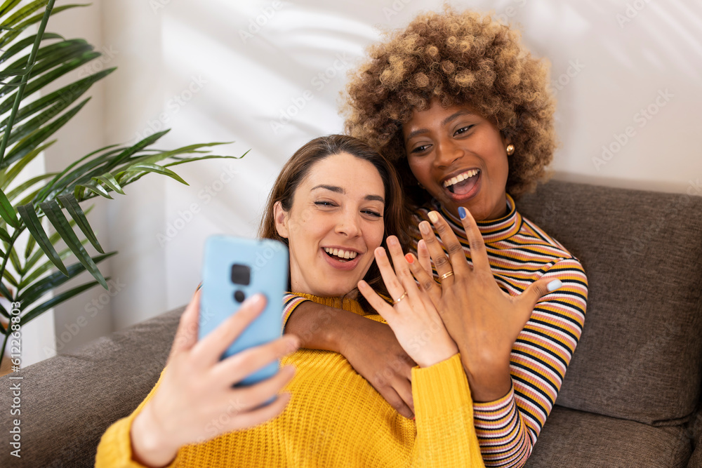 Happy Multiracial Lesbian Couple Celebrating Together With Engagement