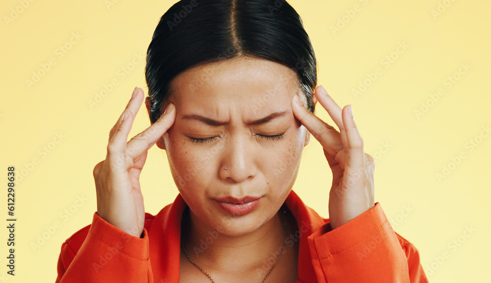 Asian woman, headache and studio with stress, migraine and hands on ...