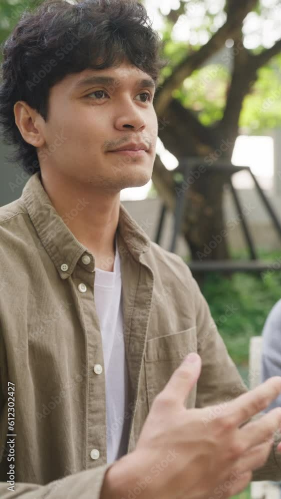 Asian group of people sit in a close circle and talk to therapist in ...