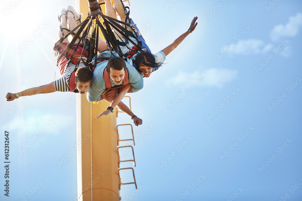 Friends bungee jumping at amusement park Stock Photo | Adobe Stock