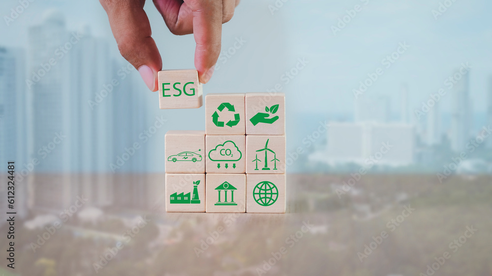 Businessman hand with wooden block. ESG icons concept. ESG environment ...