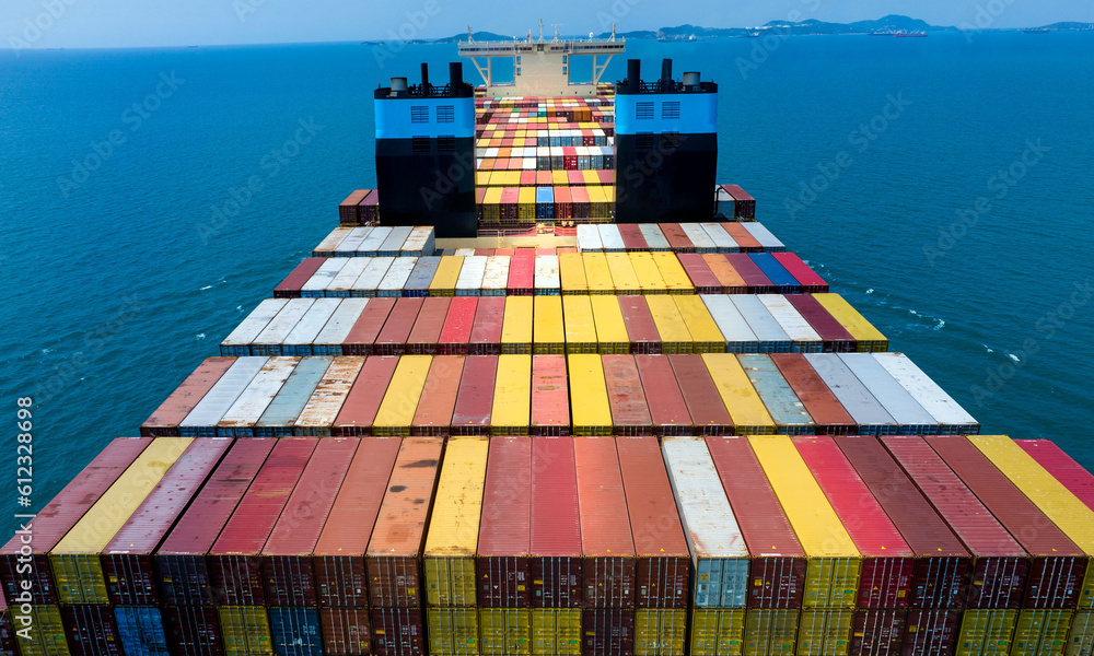 Foto de Stern of large cargo ship import export container box on the ...