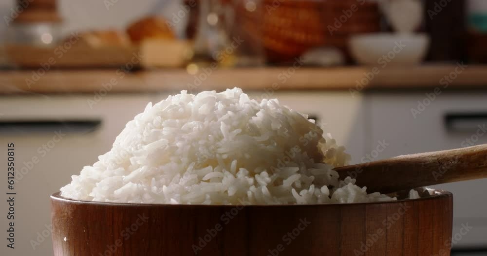 Hot white cooked rice steam bowl kitchen background mixed wooden spoon ...