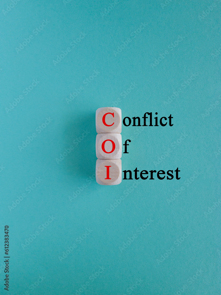 COI, Conflict of interest symbol. Wooden cubes with concept red words ...