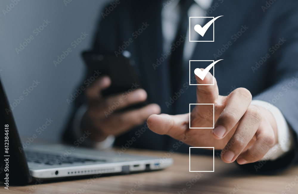 Digital smart check list, Businessman use laptop and touching marking ...
