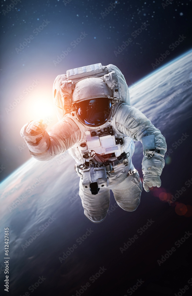 Astronaut in outer space over the planet Earth. Spaceman spacewalk ...