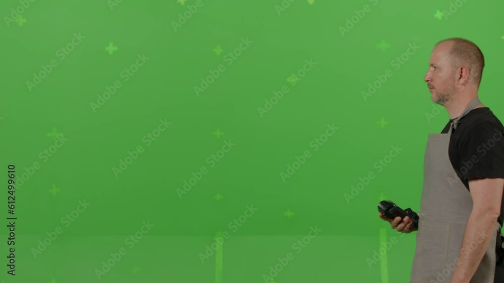 Side view of Caucasian male waiter hold wireless bank payment POS ...