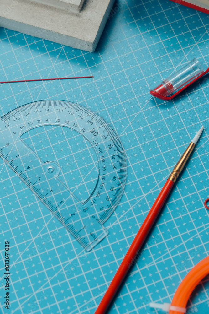 Measurement grid and office items. Stock Photo | Adobe Stock