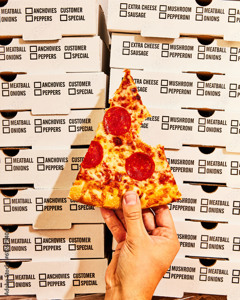 Hand Holding Pepperoni Slice Stock Photo | Adobe Stock