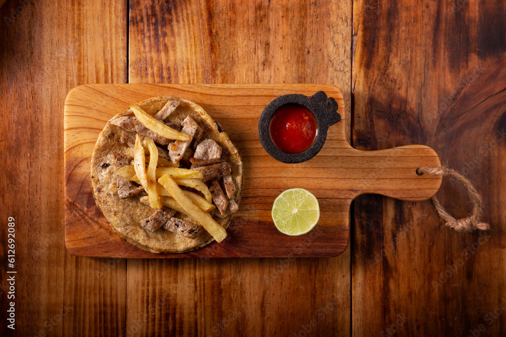 Beef steak taco with french fries. Very popular taco in Mexico called ...