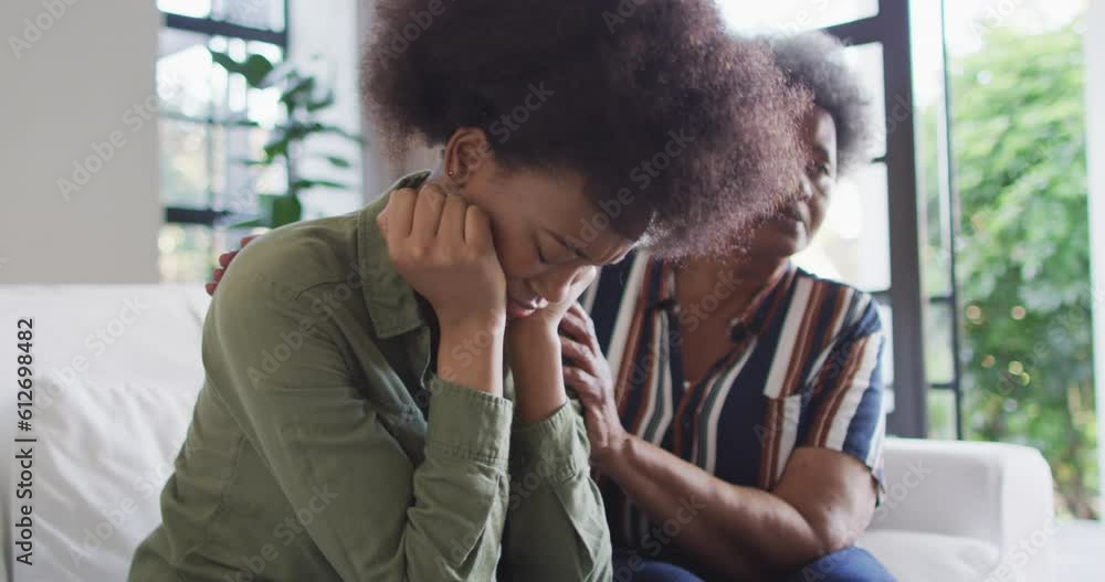 Worried african american senior mother comforting sad, crying adult ...
