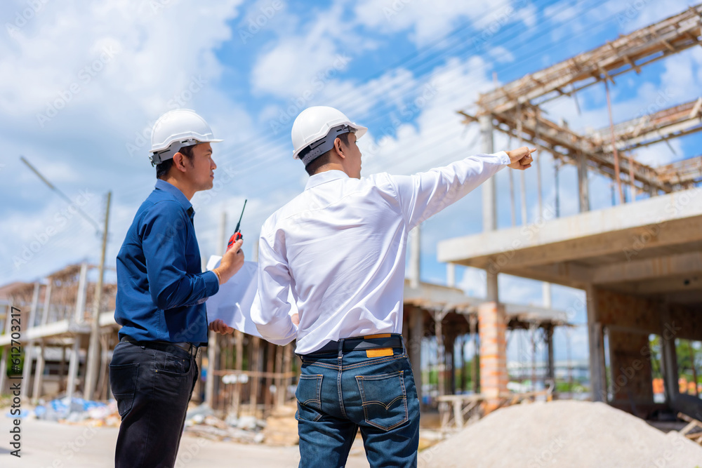 Half body portrait of 2 Asian male engineers, mechanic manager pointing ...