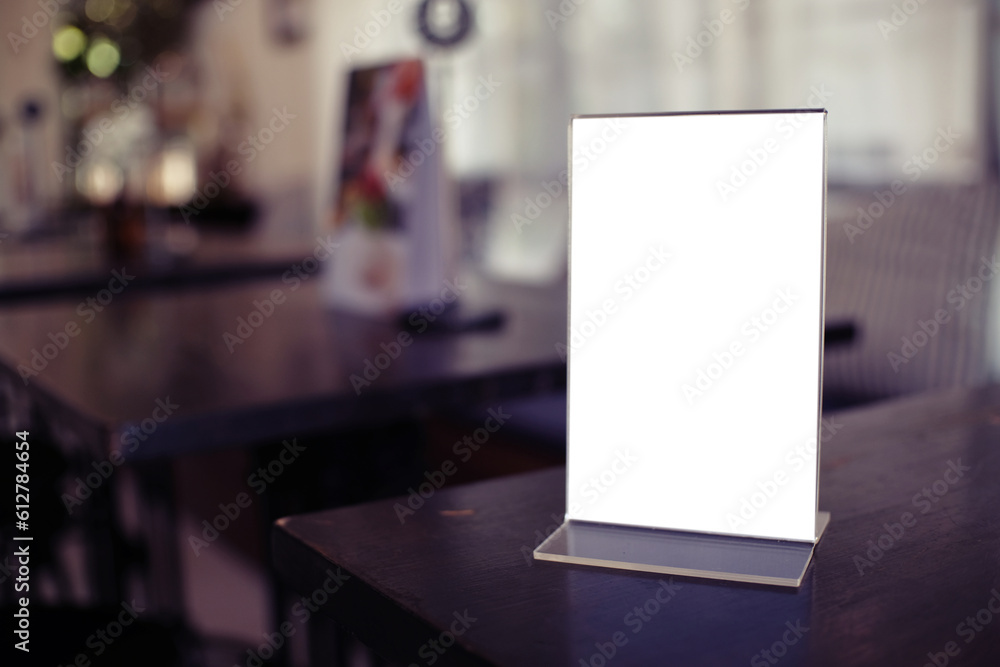 Mock up Menu frame standing on wood table in Bar restaurant cafe. space ...