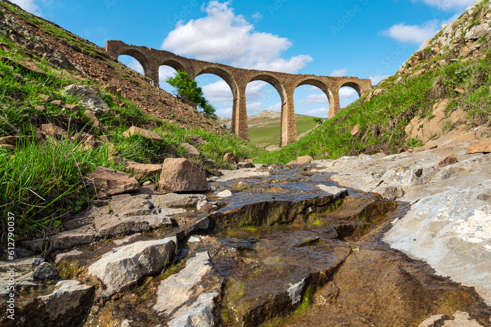An ancient stone bridge in the suburbs of the city of Gadabay, built by ...