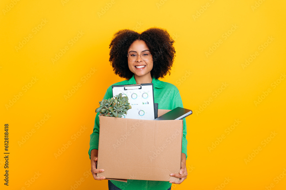 New job. Happy brazilian or african american woman, holding cardboard ...