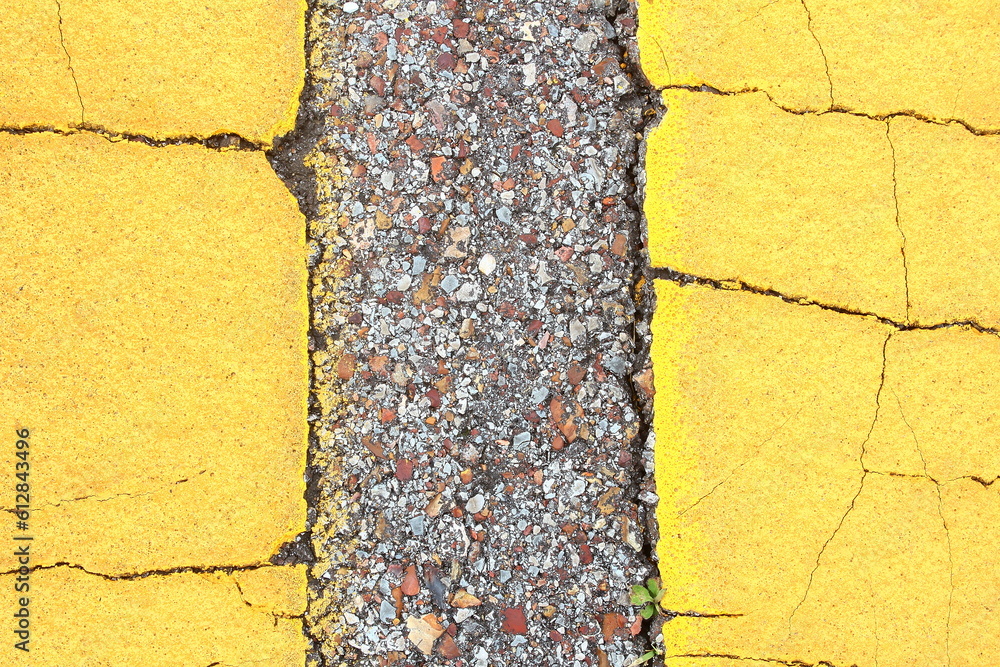 yellow paint color divider safety line on road,asphalt crack rough ...