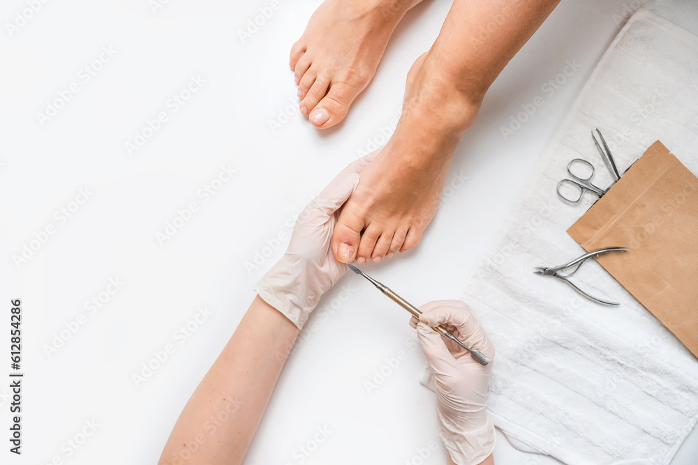 Pedicure, podologist. Patient on medical pedicure procedure, nail ...