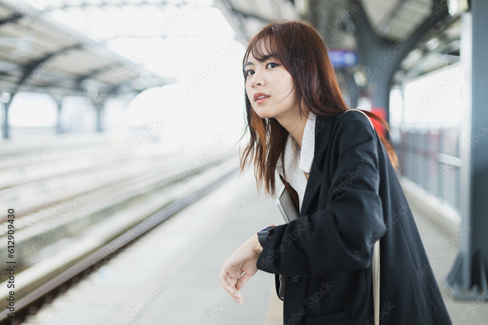 Attractive women working lifestyle holding laptop waiting for public ...