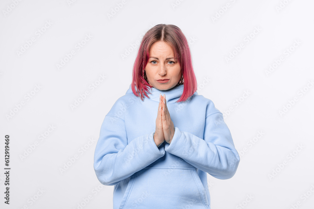 Pleading begging beautiful attractive woman standing holding hands ...