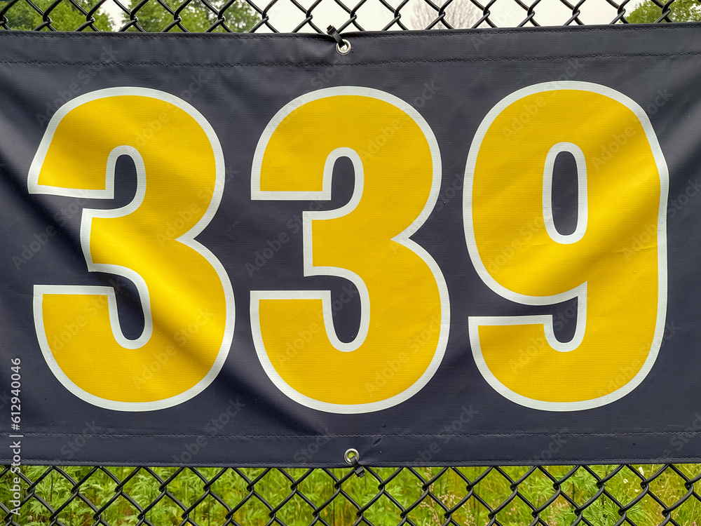 339 foot ft baseball field distance sign in yellow and black mounted on ...