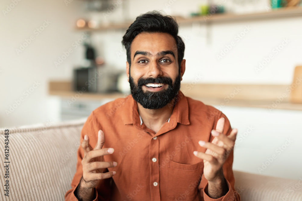 Portrait of indian man talking looking at camera at home Stock Photo ...