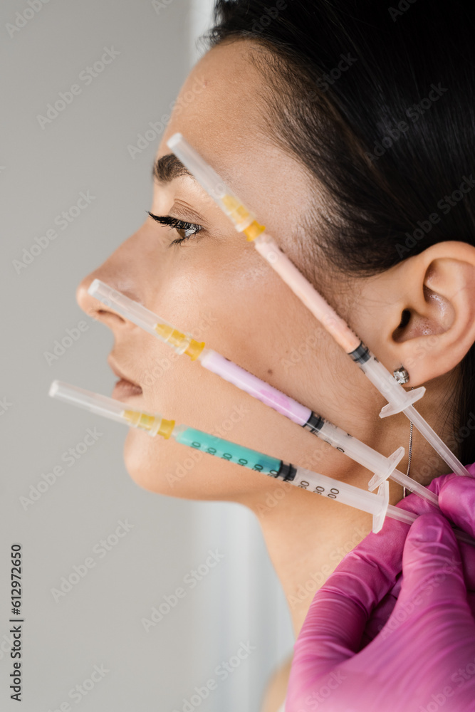 Girl with vitamin cocktail syringes for injections close-up ...