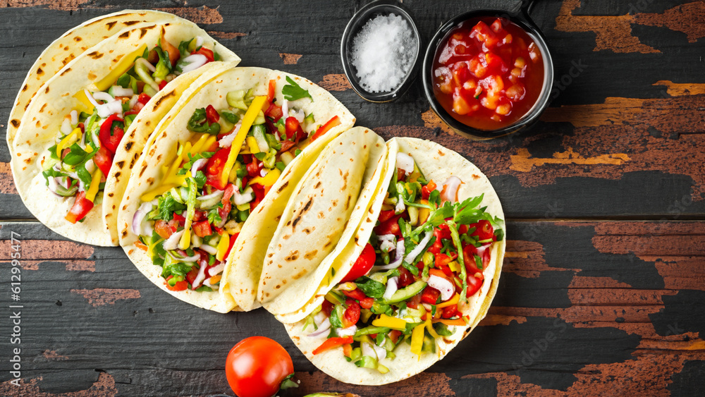 Tacos with vegetables and salsa. Mexican kitchen. Wooden rustic ...