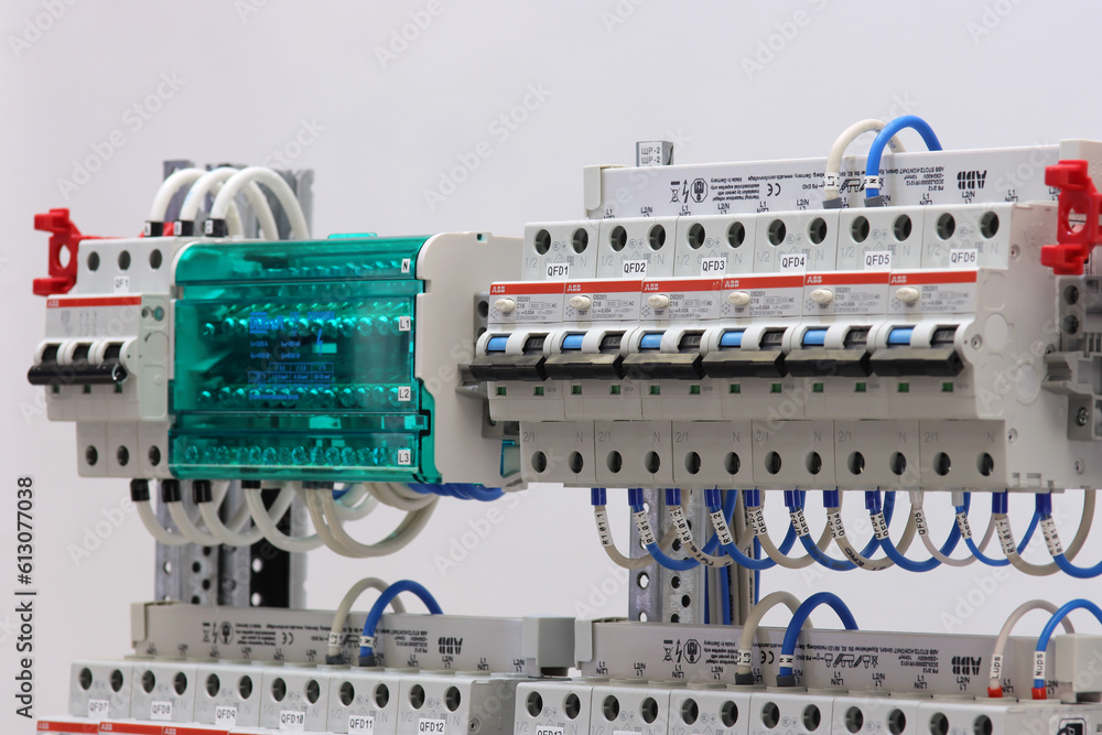 electric circuit breakers installed on a din rail in an electric ...