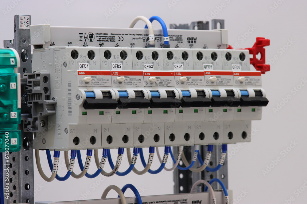 electric circuit breakers installed on a din rail in an electric ...
