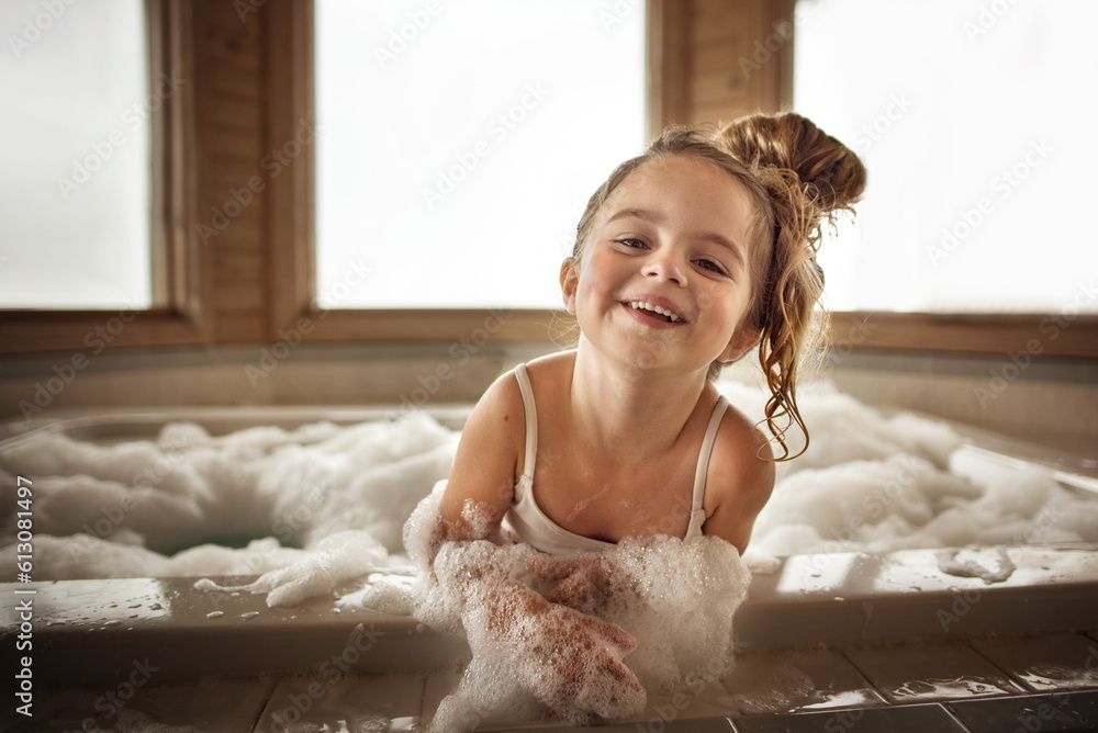 Cute little girl playing and laughing in bubble bath Stock Photo ...