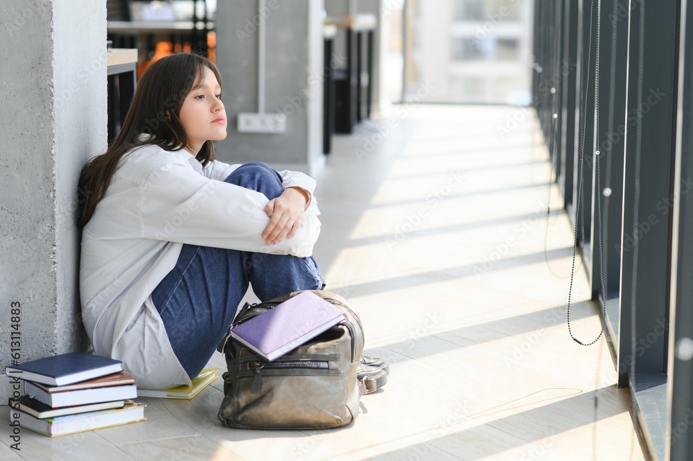 Asian young girl student sitting alone with sad feeling at school Stock ...
