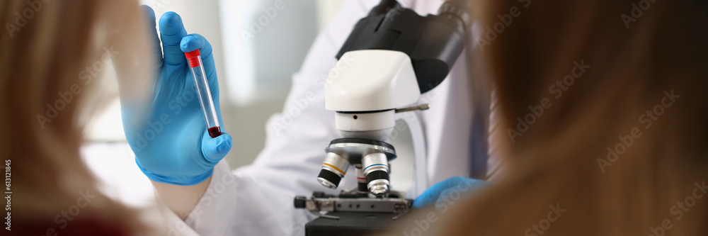 Scientists in the laboratory examine blood sample in sample tube. Dna ...