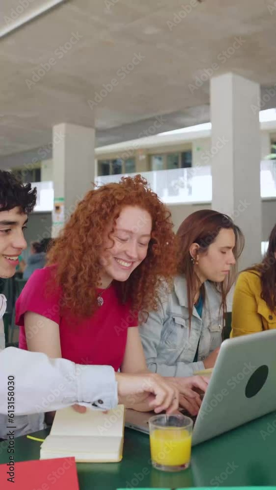 Young group of high school students studying together with laptop ...
