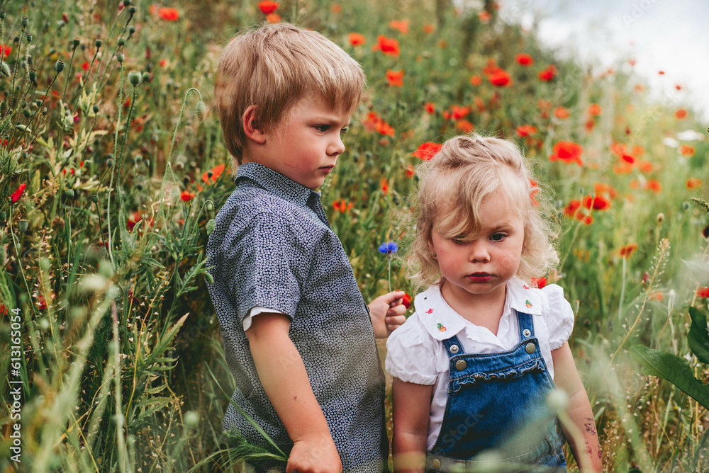 four year old boy and two year old girl shaking head sadly - shy ...