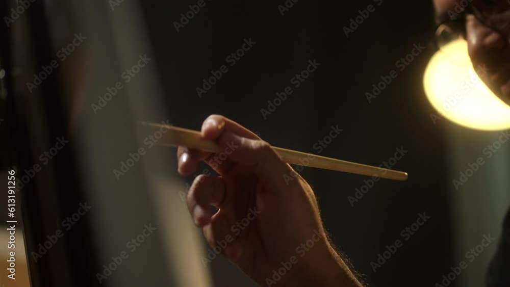 Close-up Moving Paint brush holding on hand of artist and painting on ...