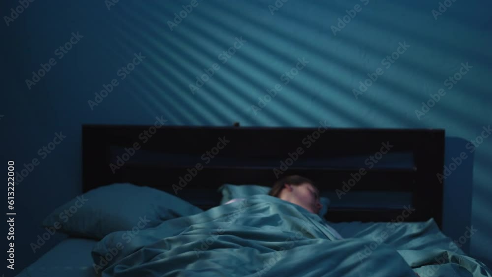 Insomnia and nightmare concept. Shocked scared woman waking up from a ...