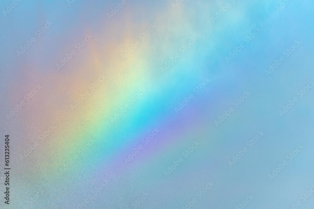 Rainbow colors in the stream of water from an agricultural sprinkler ...