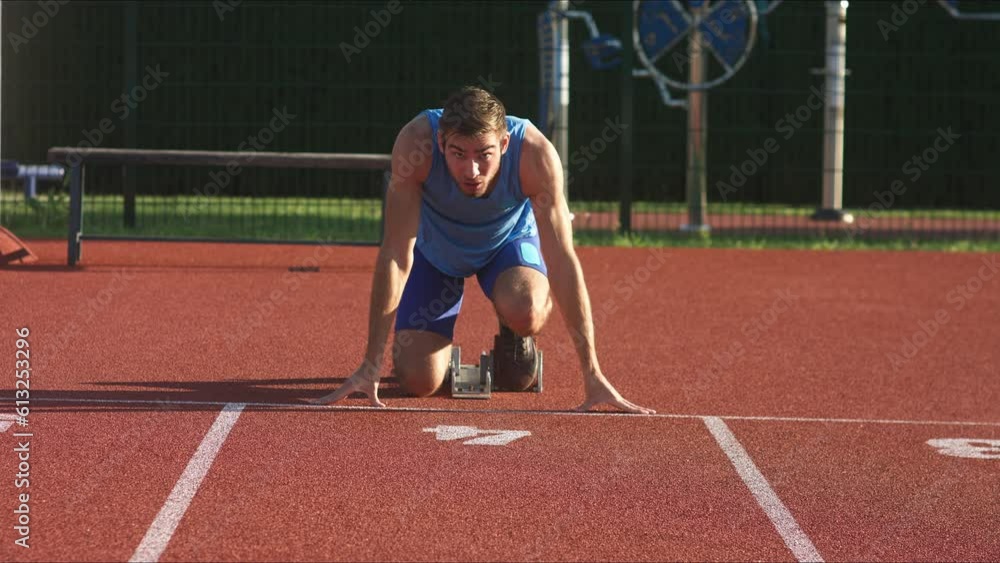 Male Caucasian young runner before the race, beyond start line in ...