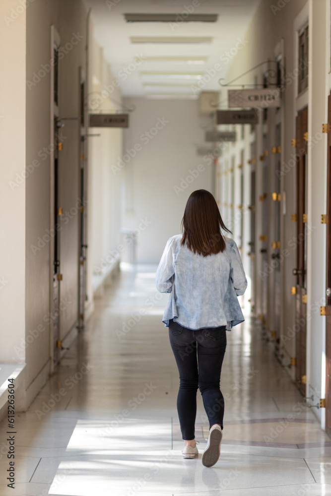 female international school student dressed in jeans walked inside ...