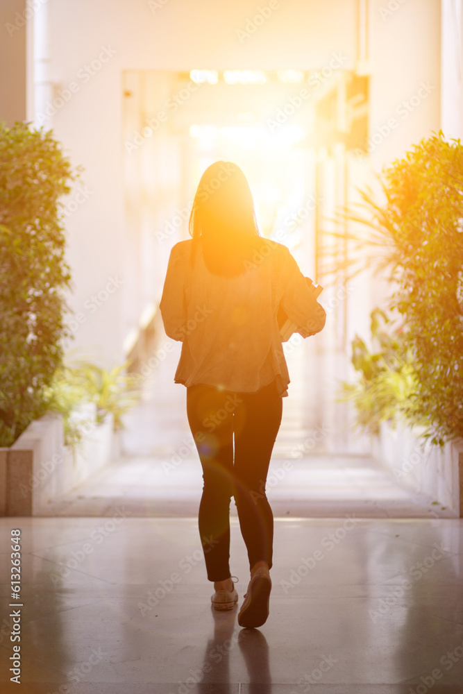 female international school student dressed in jeans walked inside ...