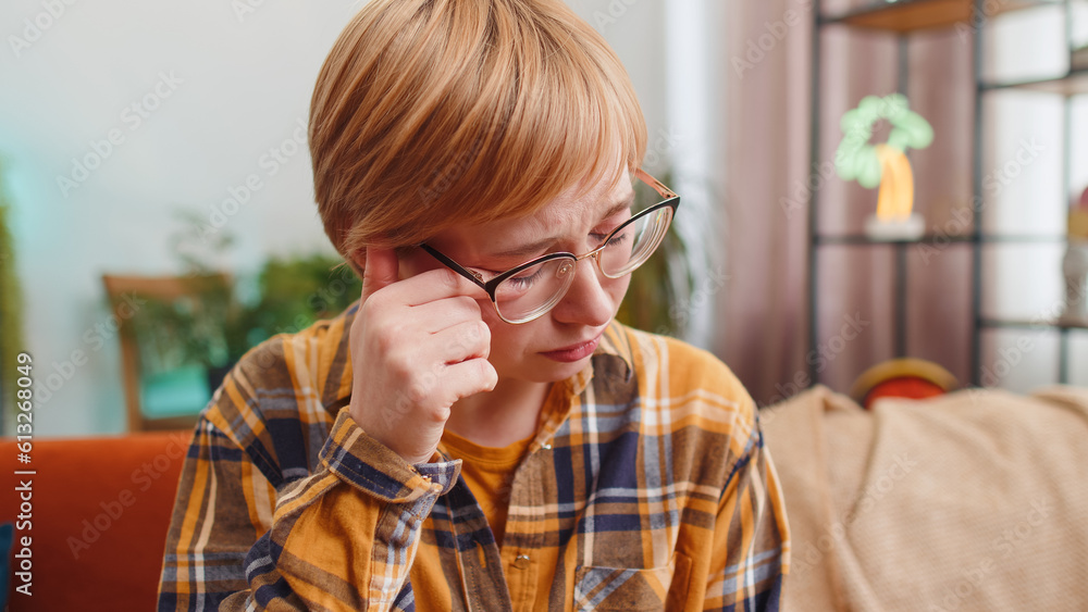Upset disappointed young woman wipes tears and cries from despair ...
