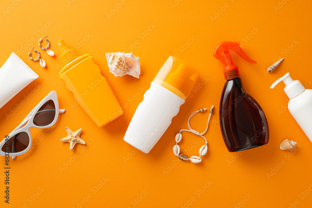 Ultraviolet Safety Month concept. Above view photo of shells and a ...