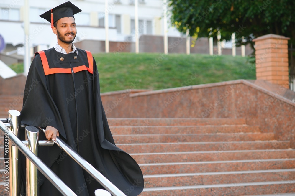 Young indian graduated boy holding his graduation degree convocation ...