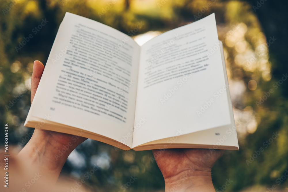 Open book on a sunset background. Reading, studying, school. Read a ...