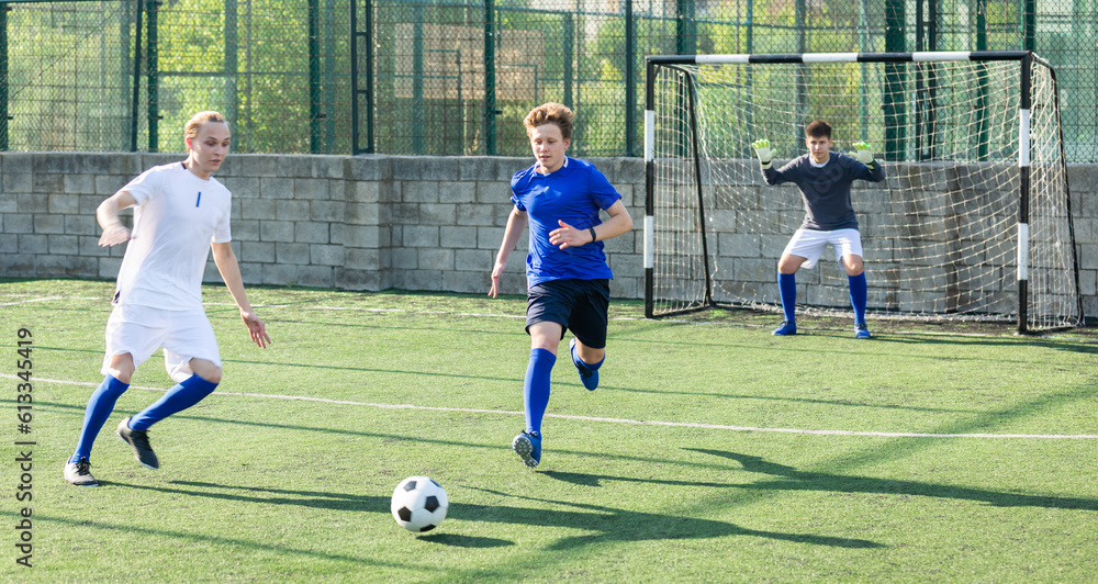 Football soccer players with ball. Footballers kicking football match ...