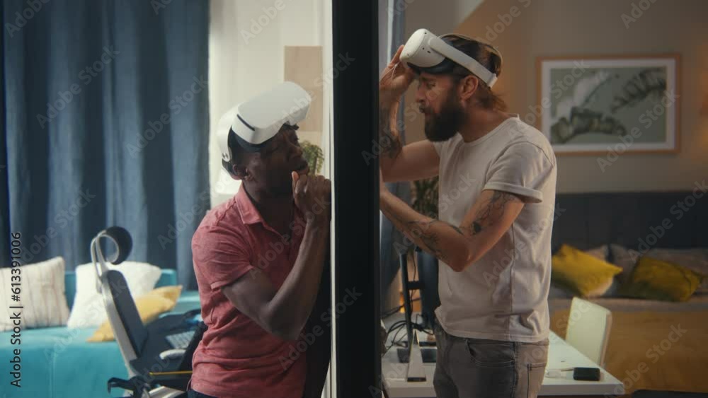 Angry multi ethnic men in VR headsets hit the wall with hands, yell at ...