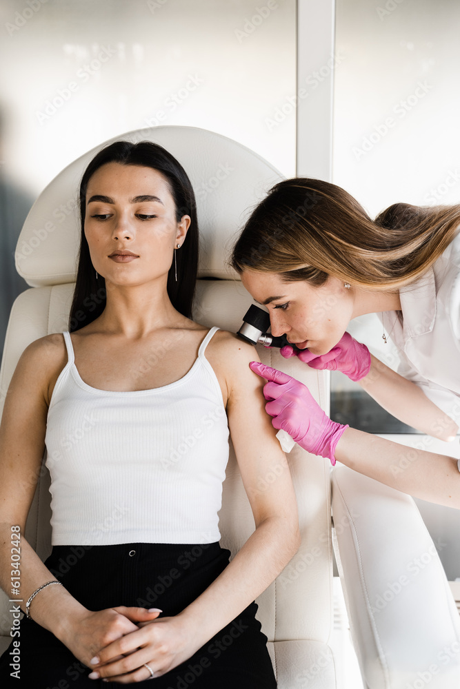 Poster Dermatoscopy of skin lesions and moles with dermatoscope for ...