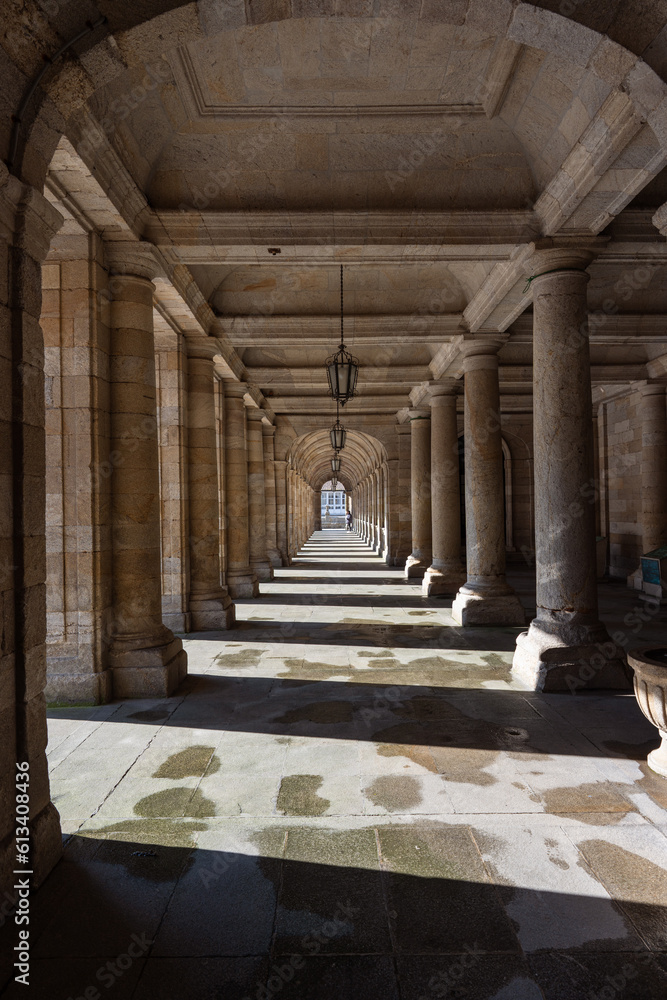 corridor with columns with perspective in vanishing point where light ...