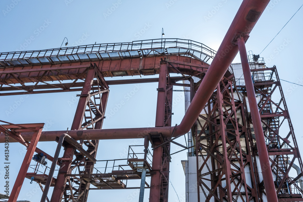old rusty pipes, ladders and frames and metal inside an industrial ...